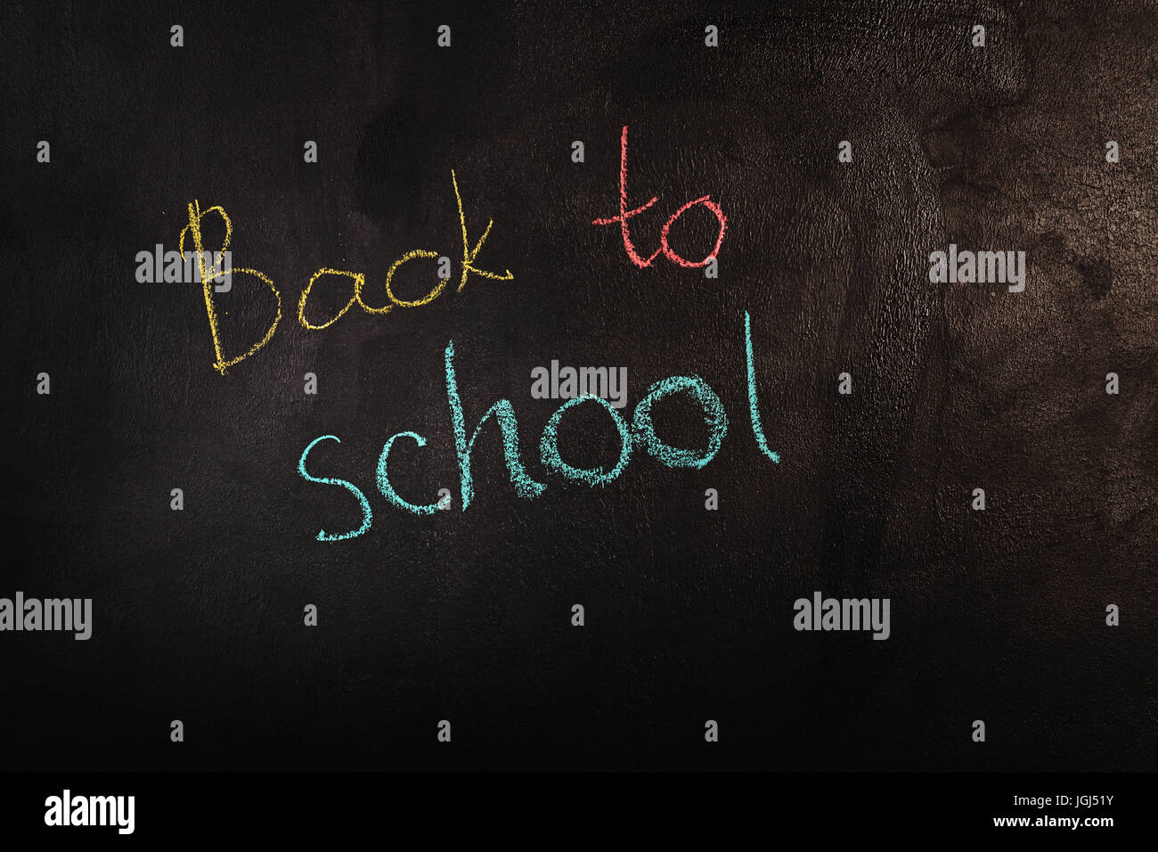 Back to school. Chalk on a blackboard. Background to the beginning of ...