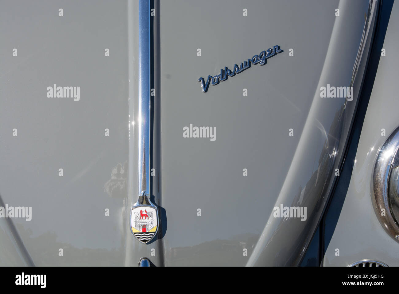 Volkswagen Script and Wolfsburg Coat of Arms on the hood of a late ...
