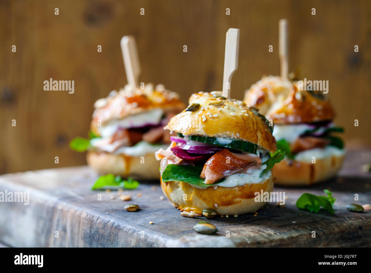 Seeded brioche buns with hot smoked salmon, beetroot and rocket salad ...