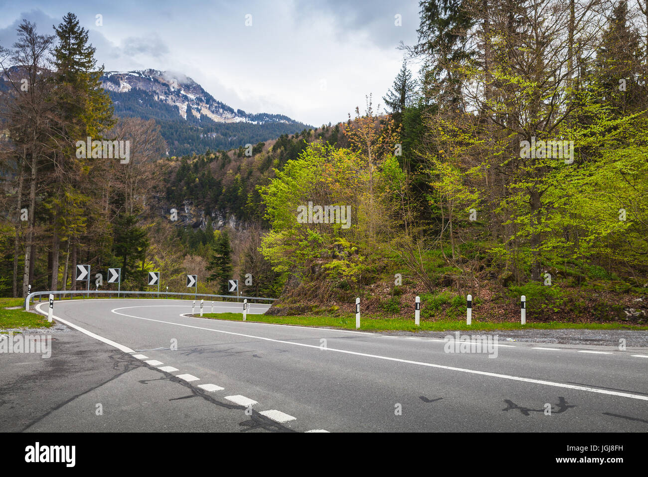 Turning mountain highway in spring season. Switzerland, Alps Stock ...