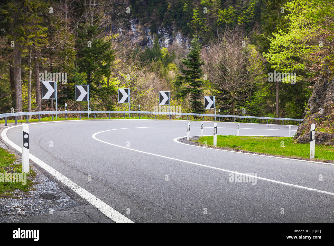 Turning mountain highway in spring season. Swiss Alps Stock Photo - Alamy