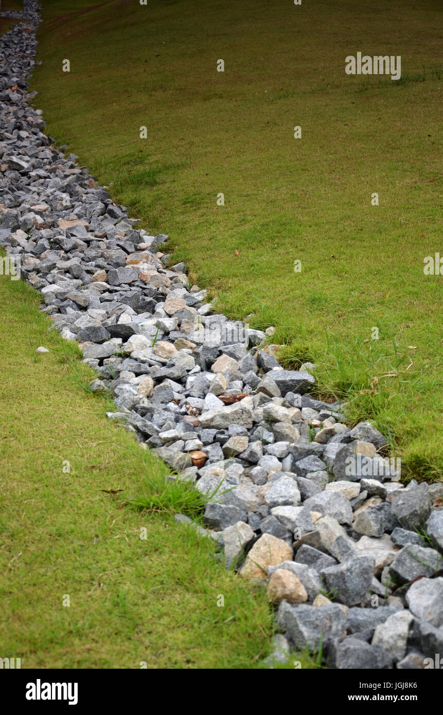 Stone and green grass in the garden Stock Photo - Alamy