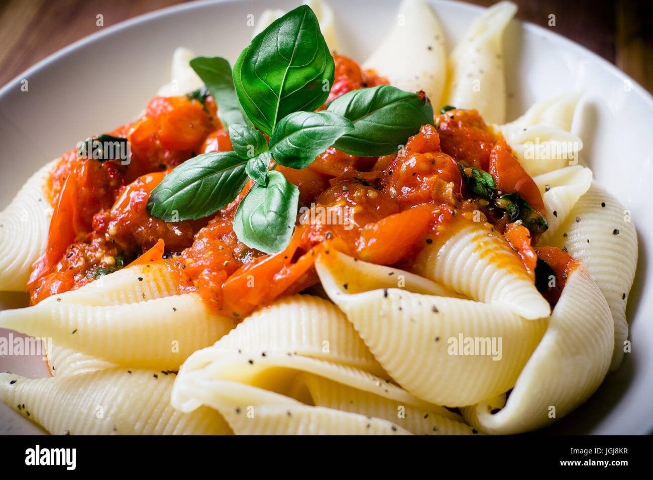 Pasta Shells with a Tomato Sauce and Basil Stock Photo - Alamy