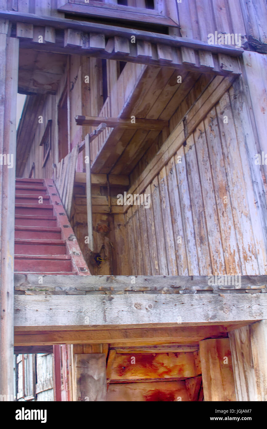 ruins of an abandoned houses. Wooden country house covered with ...