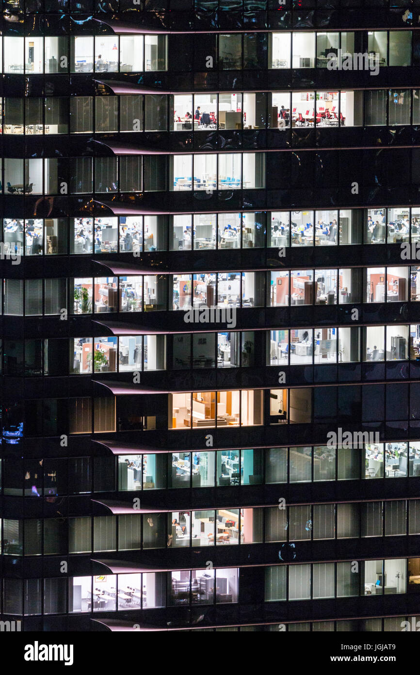 Office block, close up of windows on side of black at night time, with ...