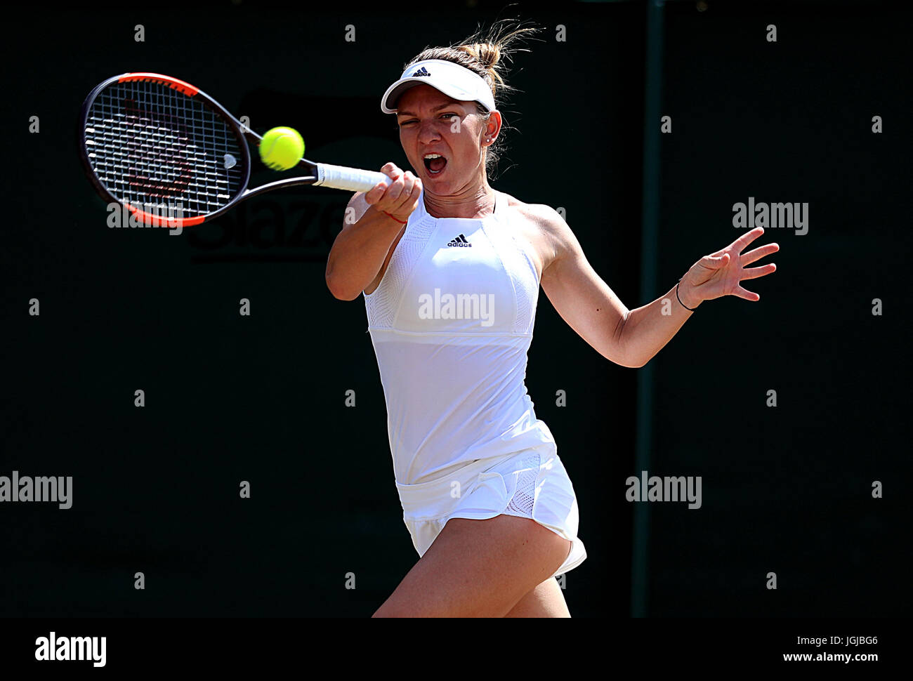 Simona Halep in action against Shuai Peng on day five of the Wimbledon ...