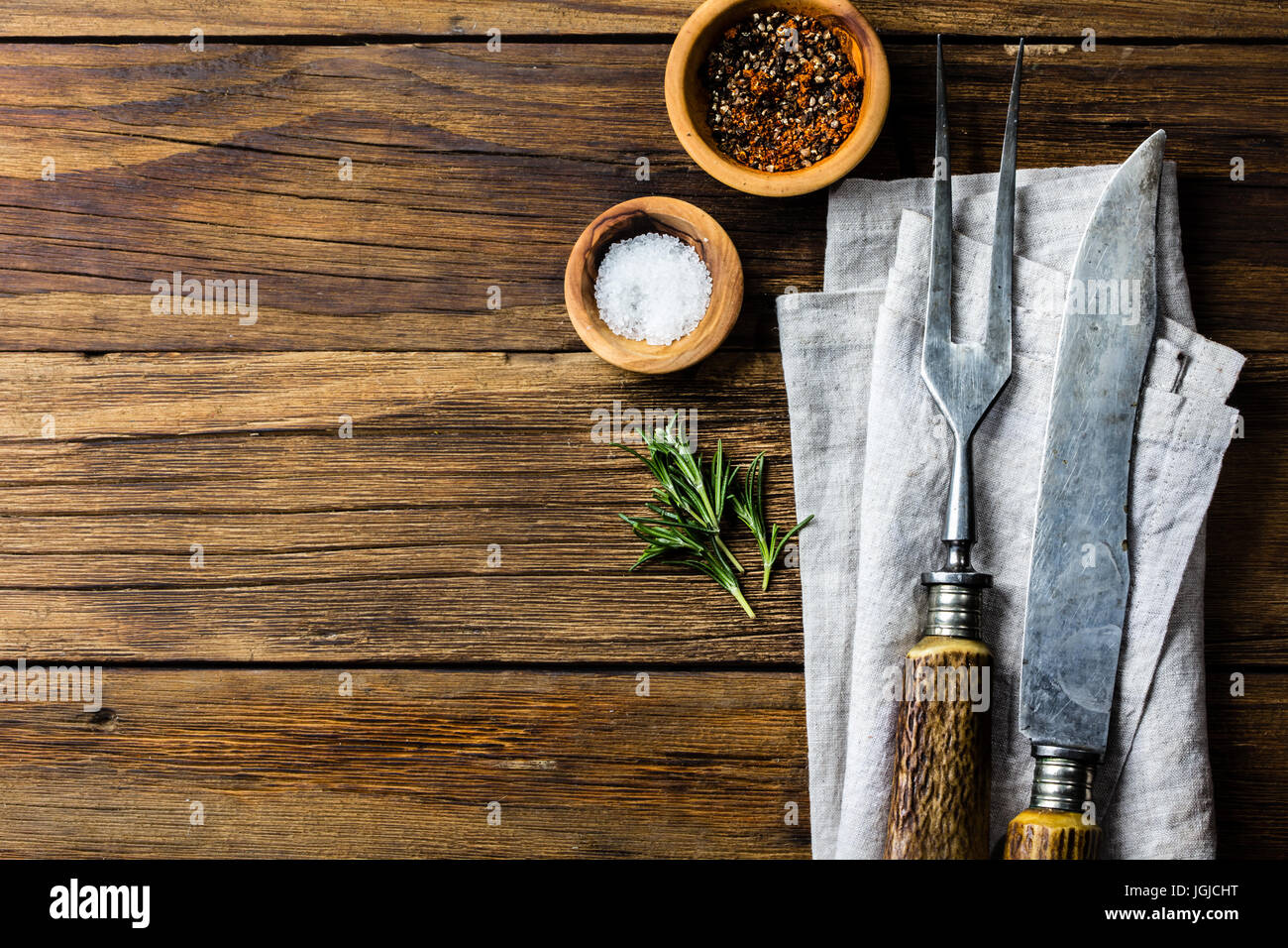 Cooking background concept. Vintage cutlery, spices and rosemary on ...