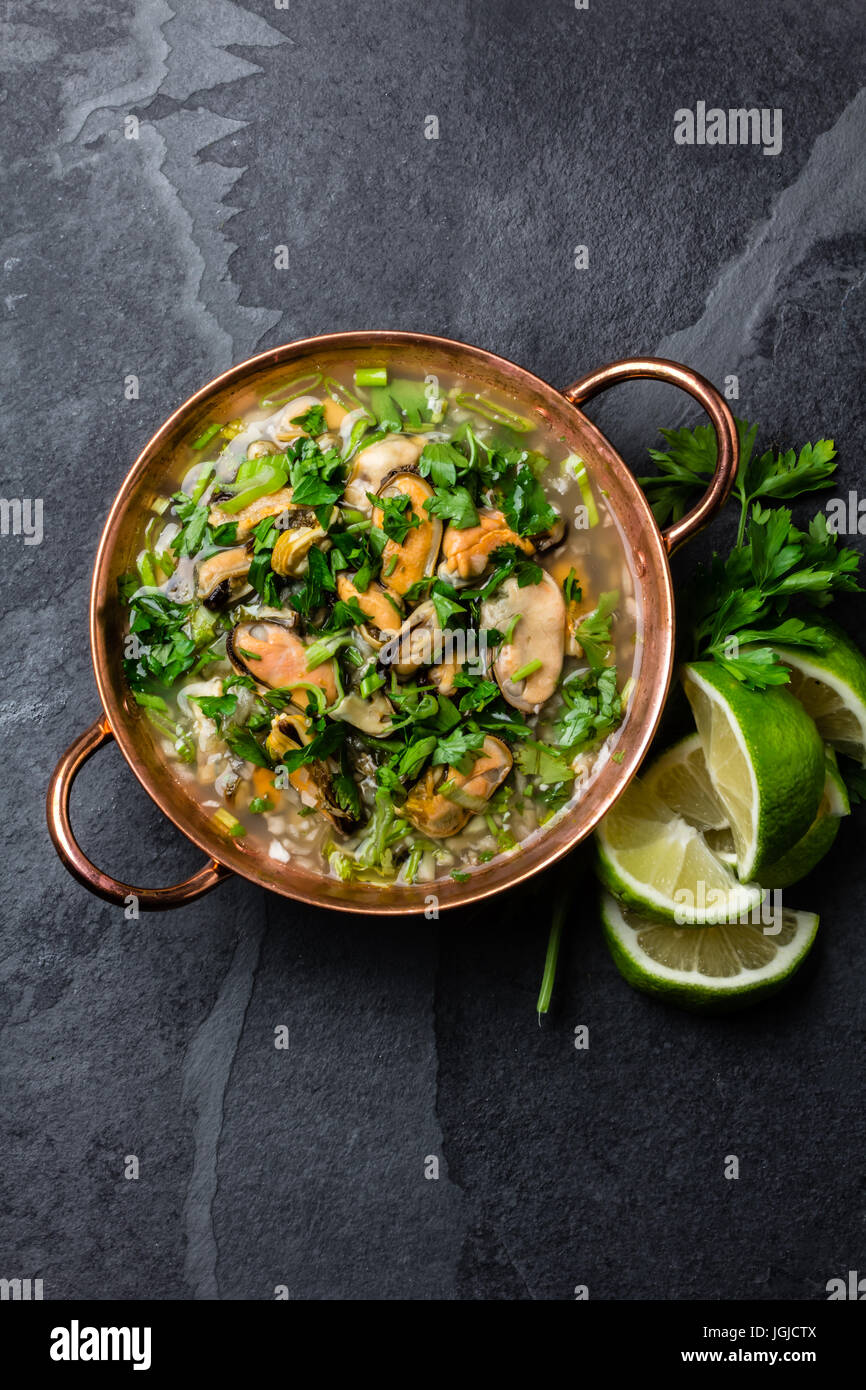 Peruvian food. Mussels ceviche. Cold soup with seafood, lemon and onion ...