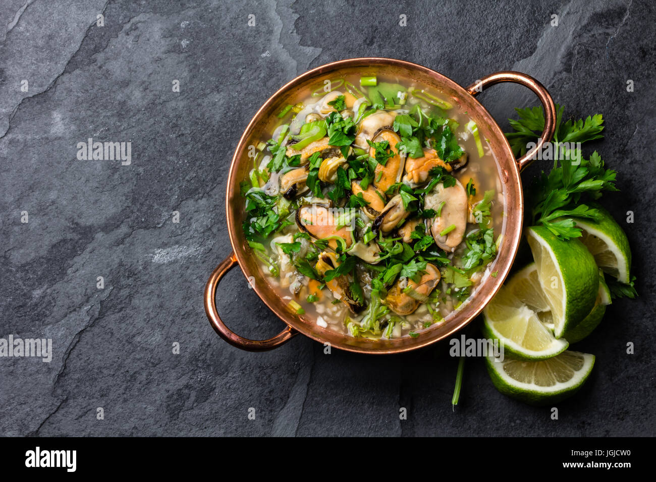 Peruvian food. Mussels ceviche. Cold soup with seafood, lemon and onion ...