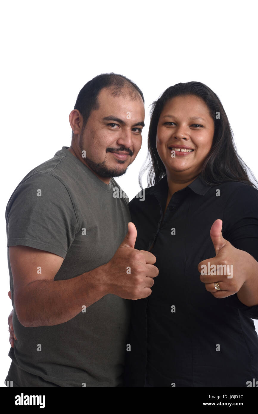 Couple doing the sign thumbs up on white background Stock Photo - Alamy