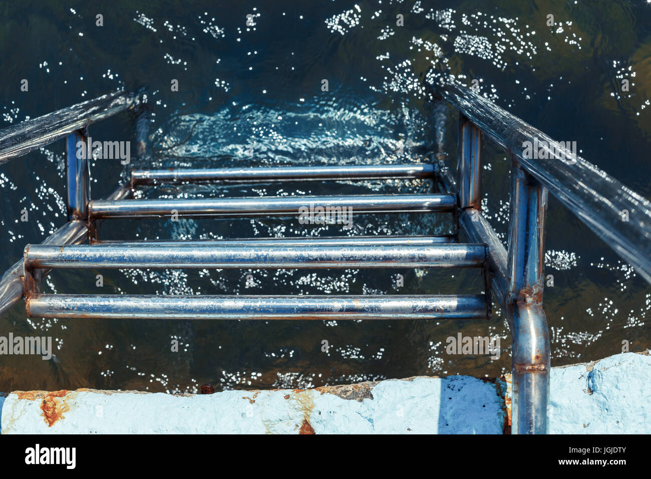 Sea, beach, sky and rails for support when entering the sea Stock Photo ...