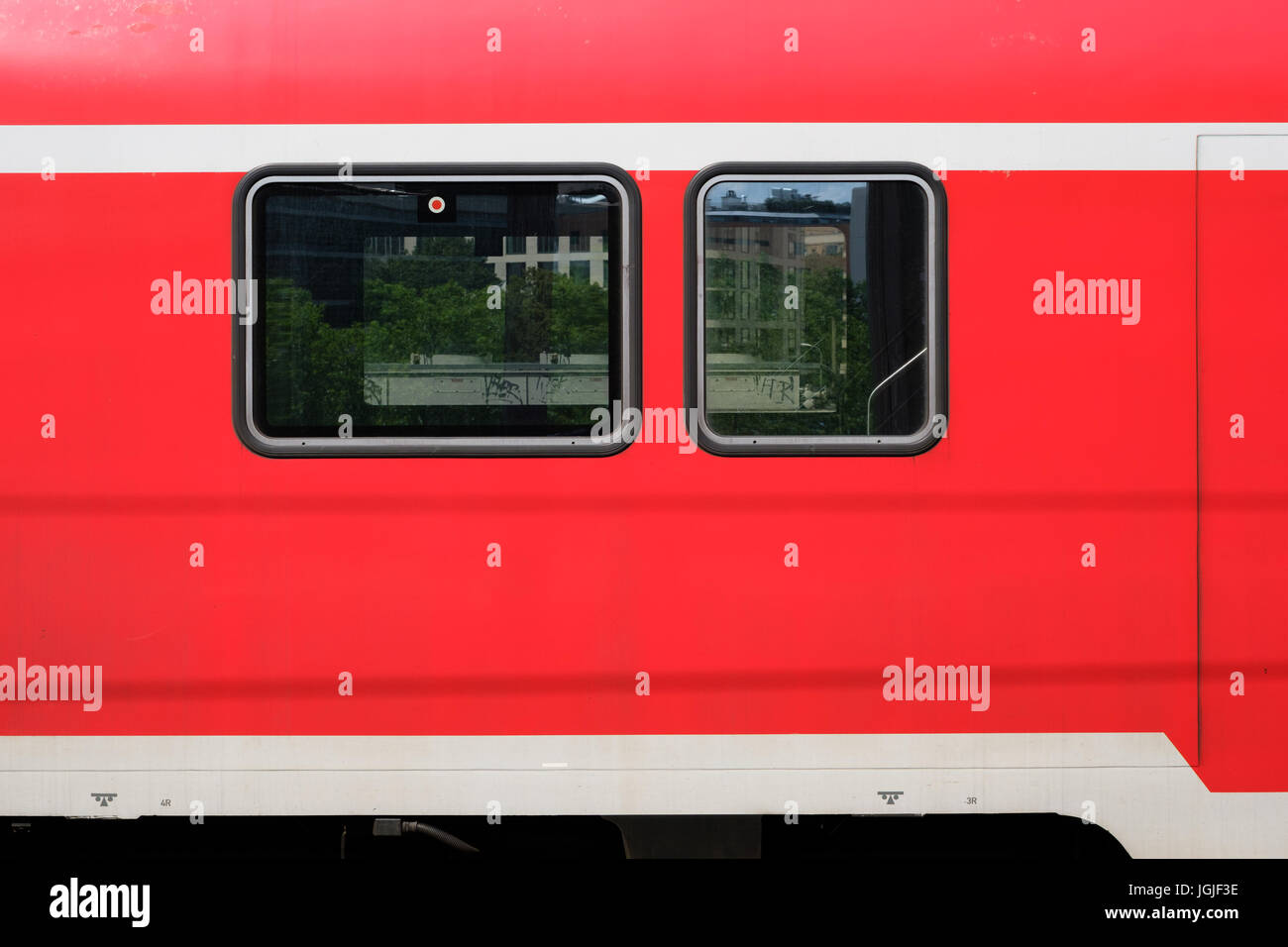 train windows of a red train wagon from outside Stock Photo - Alamy