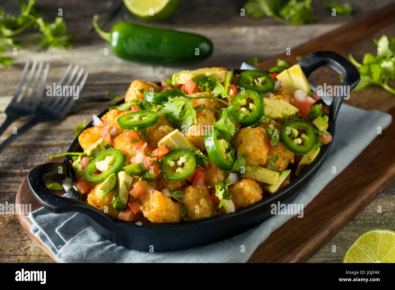 Homemade Mexican Tater Tot Nachos Tachos with Cheese Cilantro and ...