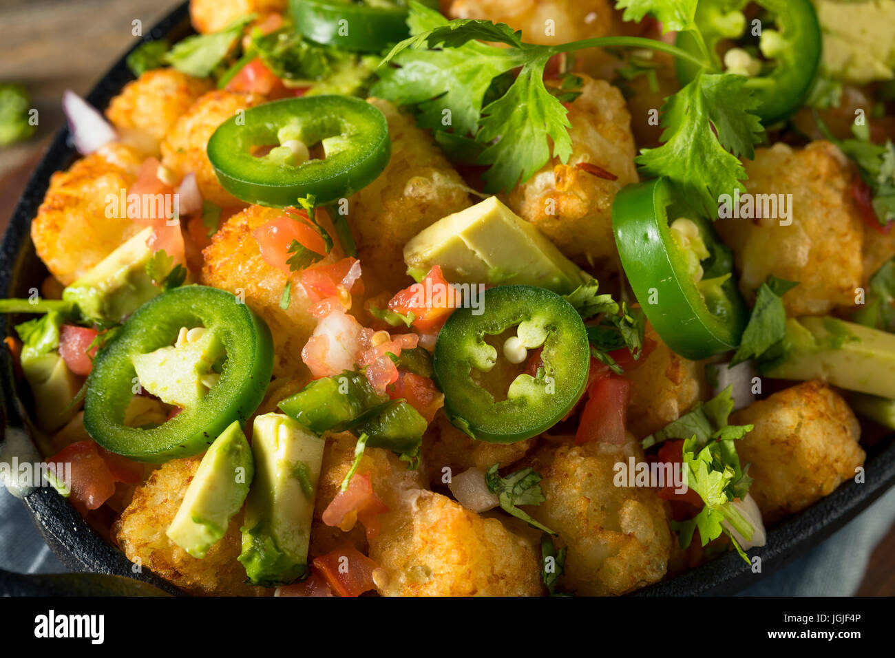 Homemade Mexican Tater Tot Nachos Tachos with Cheese Cilantro and ...