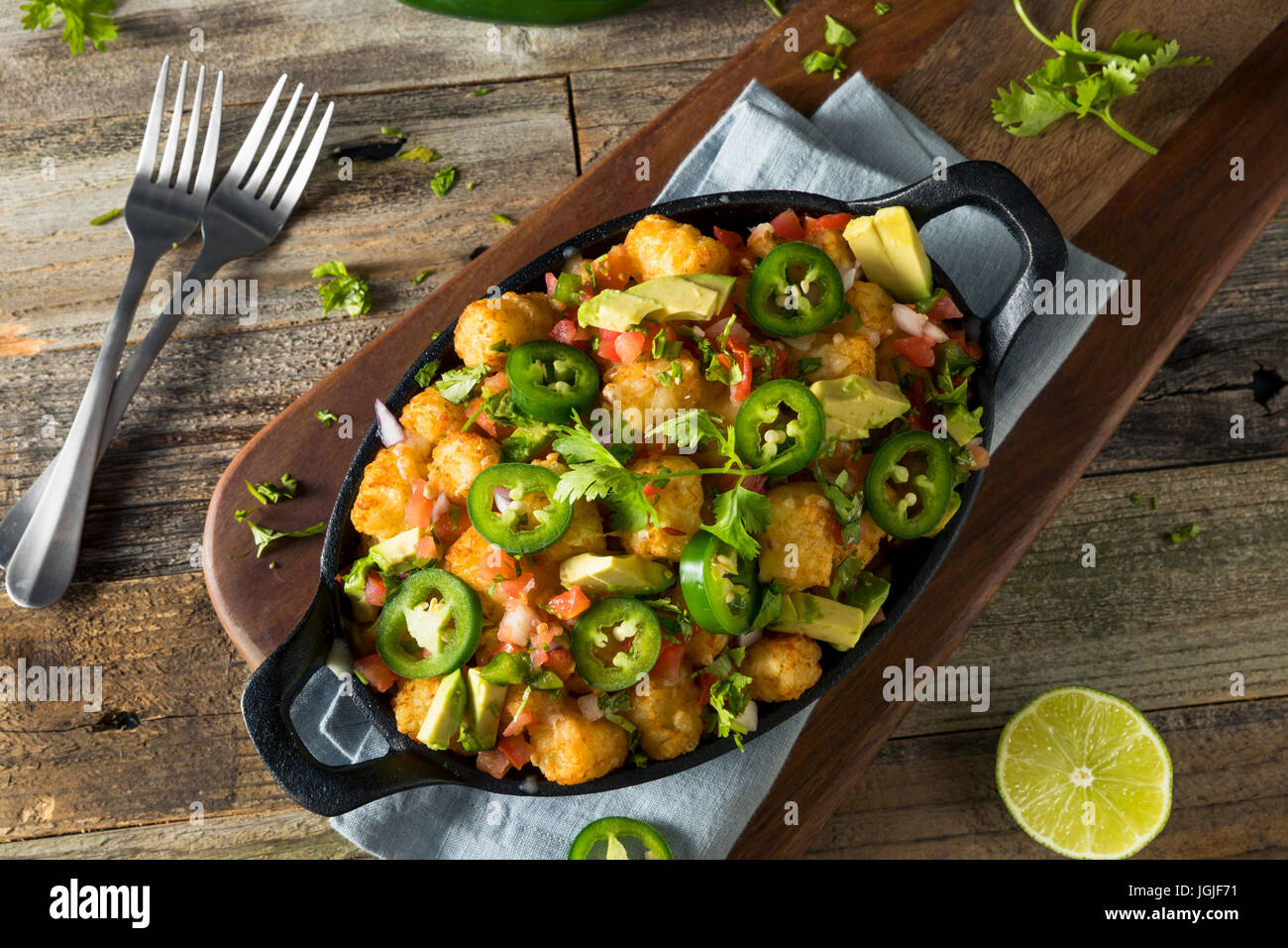Homemade Mexican Tater Tot Nachos Tachos with Cheese Cilantro and ...