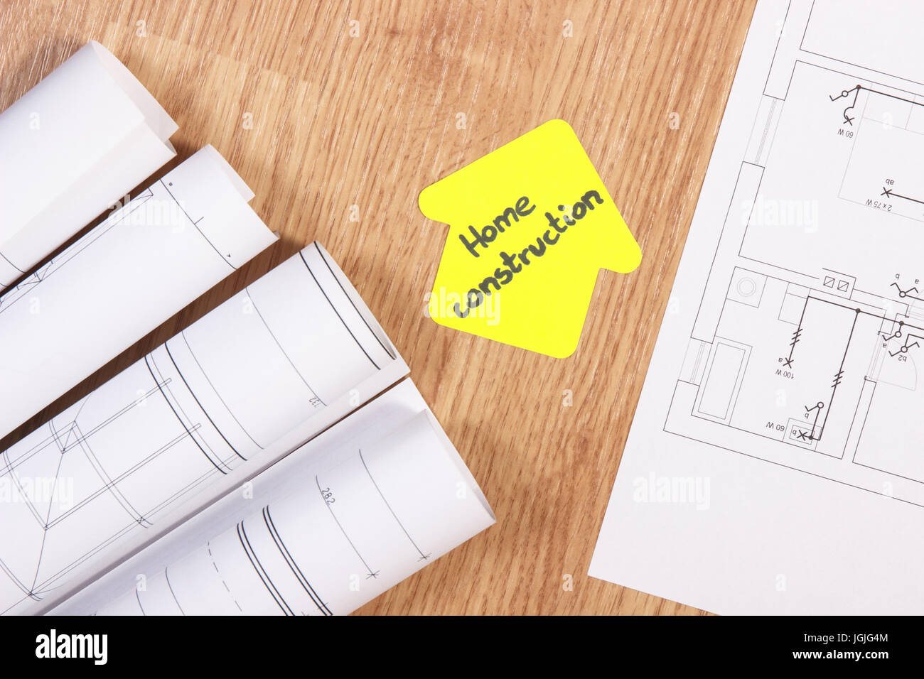 Diagrams or electrical construction drawings and yellow paper in shape ...