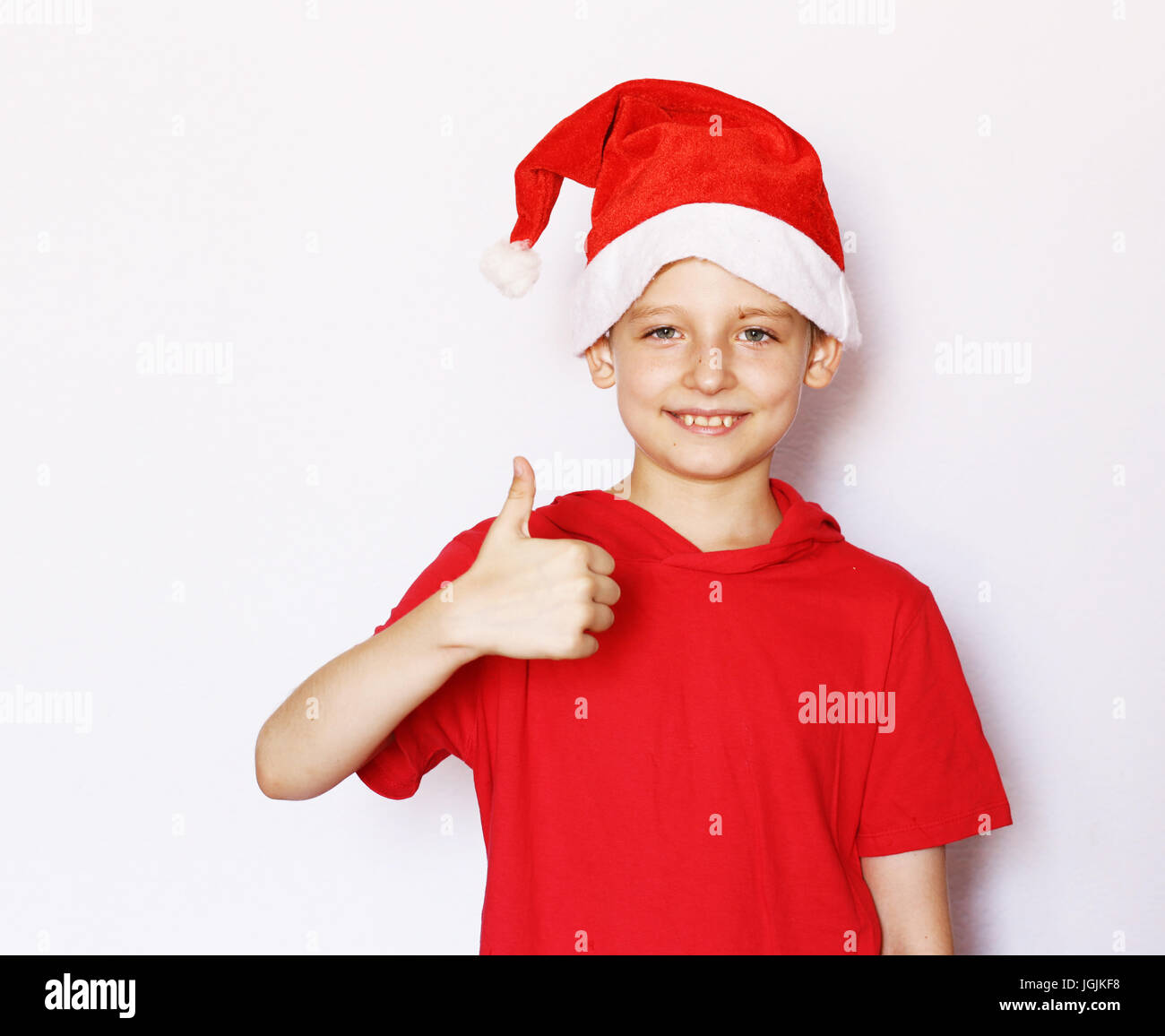 Portrait of a cute boy dressed as Santa Stock Photo - Alamy