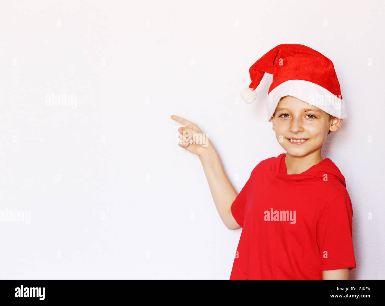 Portrait of a cute boy dressed as Santa Stock Photo - Alamy