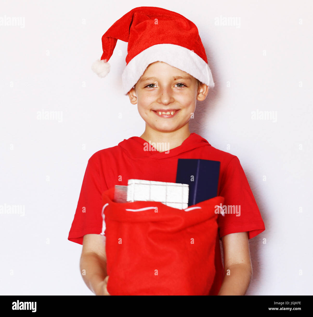Portrait of a cute boy dressed as Santa Stock Photo - Alamy