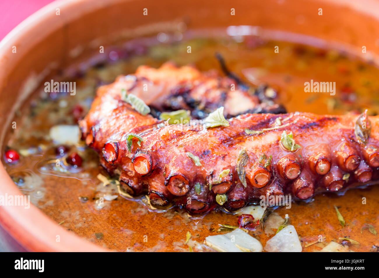 Octopus grilled with spices of black pepper, oregano with olive oil in ...