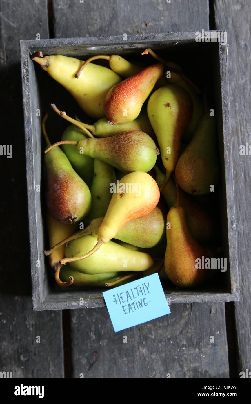 Healthy eating idea. Pears in wooden box on table and tag Stock Photo ...