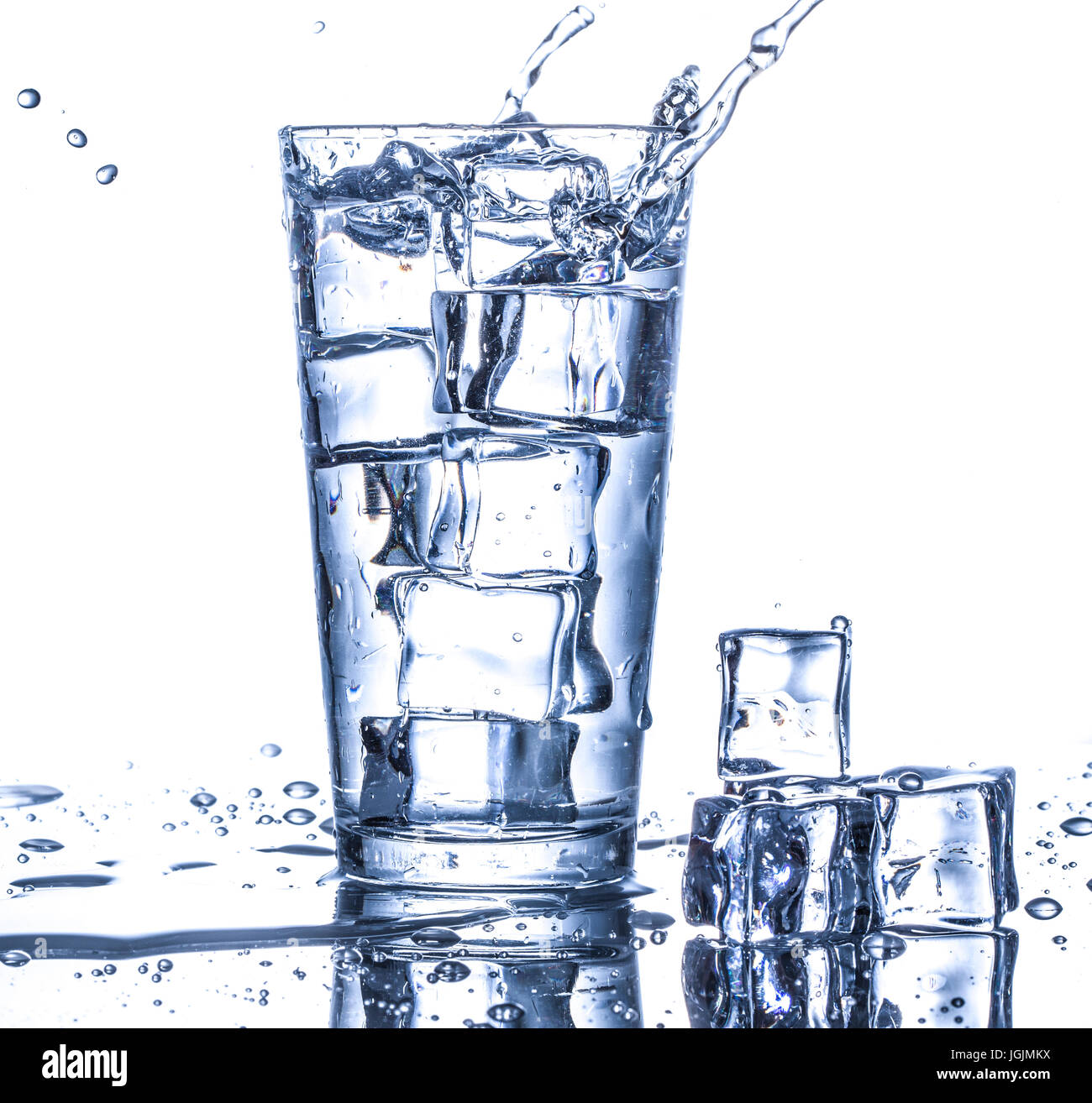 Highball glass with Ice Cubes and drink Stock Photo - Alamy