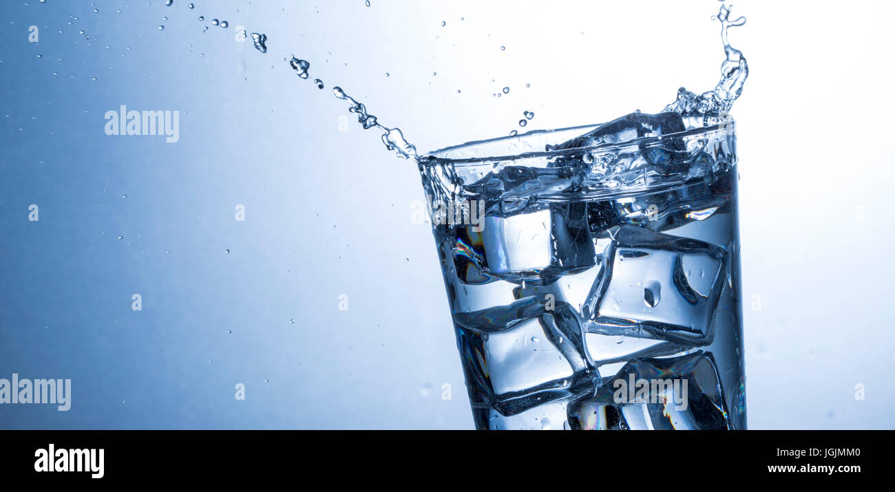 Highball glass with Ice Cubes and drink Stock Photo - Alamy
