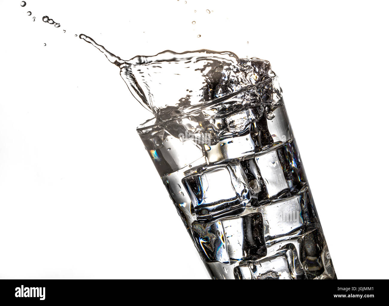 Highball glass with Ice Cubes and drink Stock Photo - Alamy