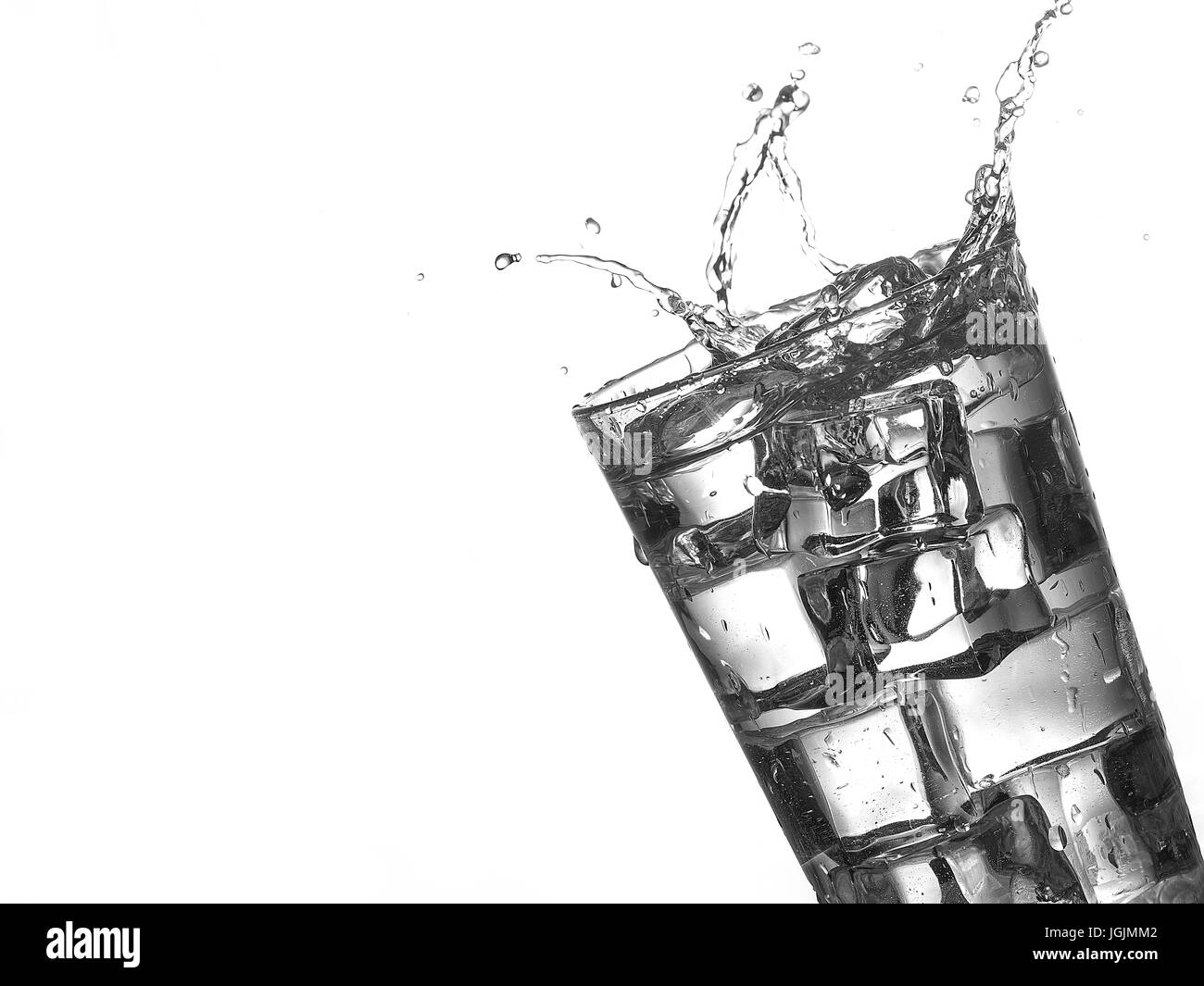 Highball glass with Ice Cubes and drink Stock Photo - Alamy