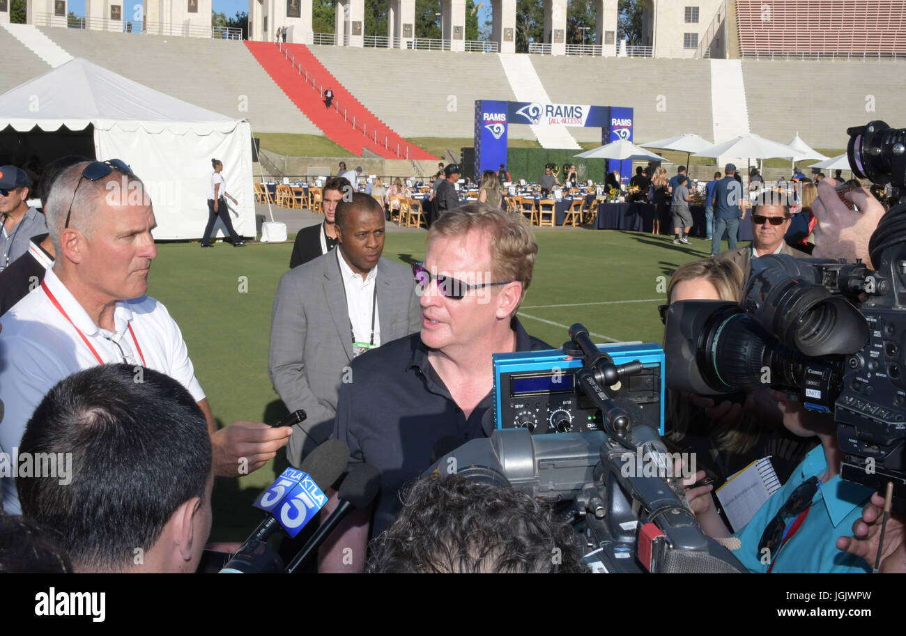NFL commissioner Roger Goodell (center) is interviewed by Los Angeles ...