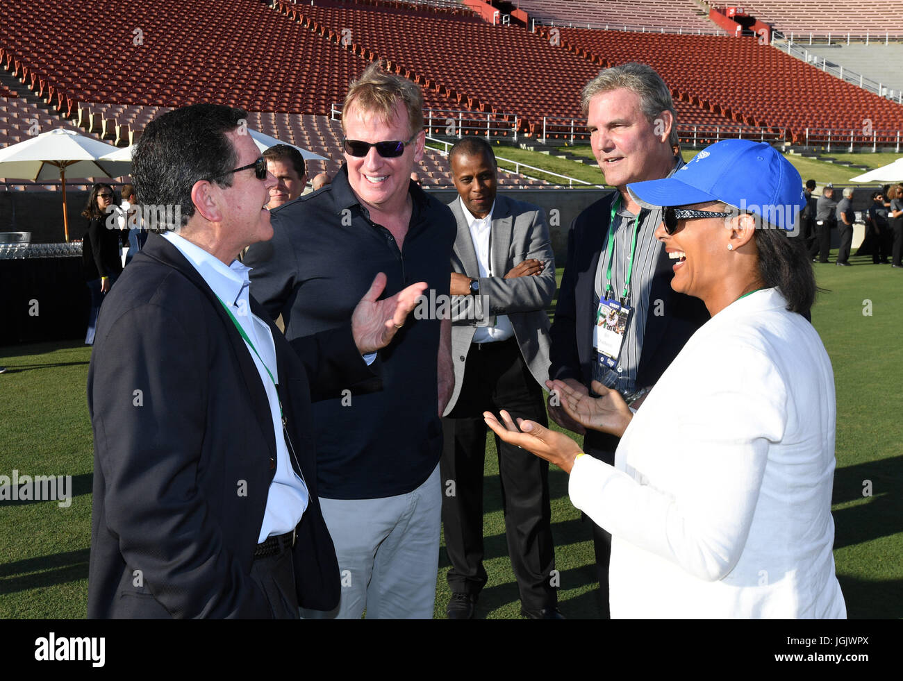 NFL commissioner Roger Goodell (second from left) visits with L.A ...