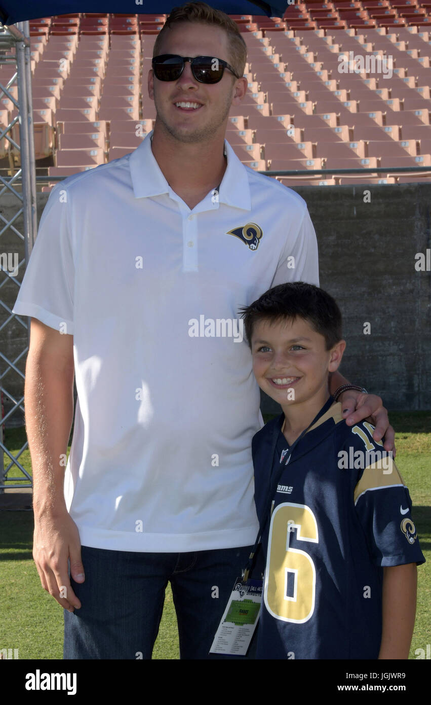 Los Angeles Rams quarterback Jared Goff (left) poses with Graham Lunzer ...