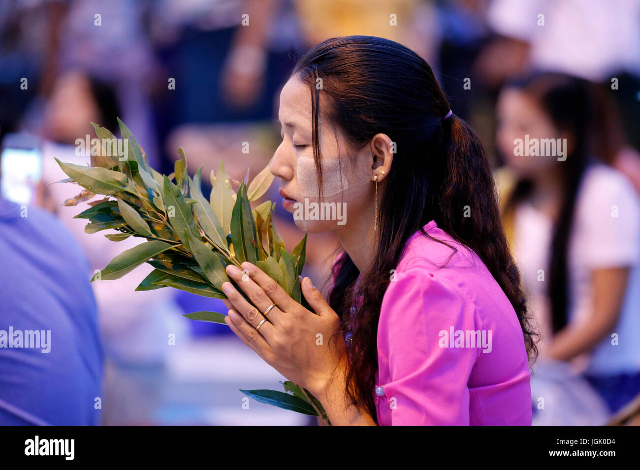 Yangon, Myanmar. 8th July, 2017. A Buddhist devotee pays homage during ...