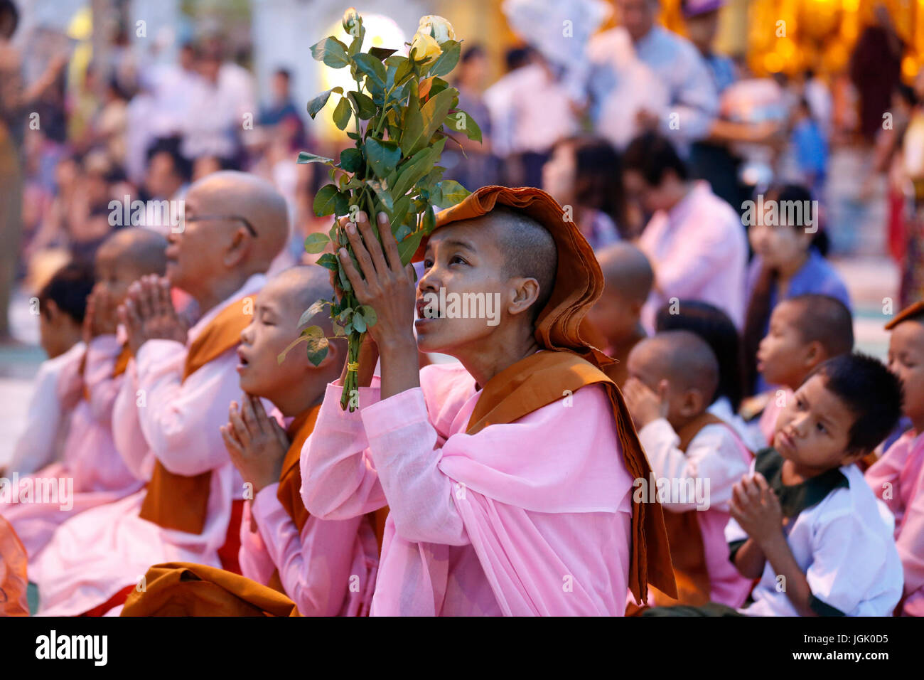 Yangon, Myanmar. 8th July, 2017. Buddhist nuns pay homage during ...