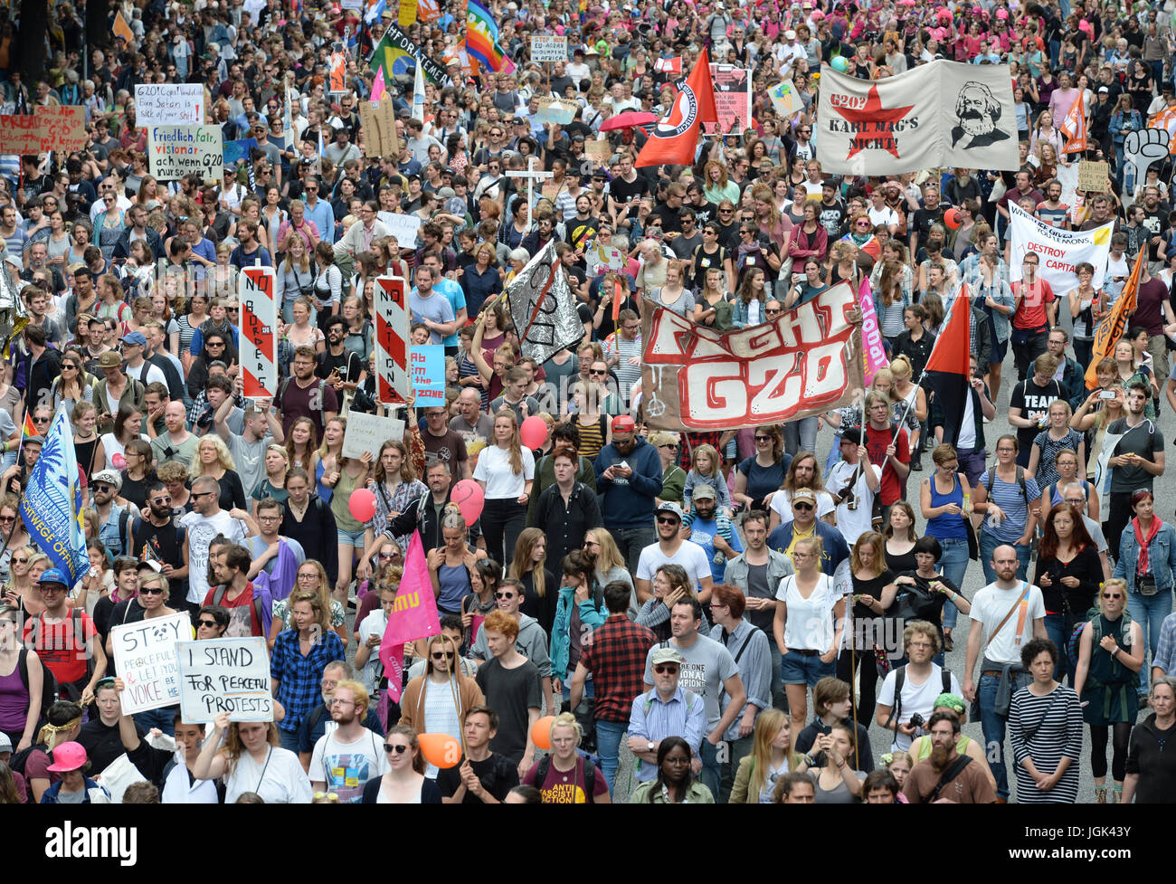 Hamburg, Germany. 8th July, 2017. Protesters carry banners and flags at ...