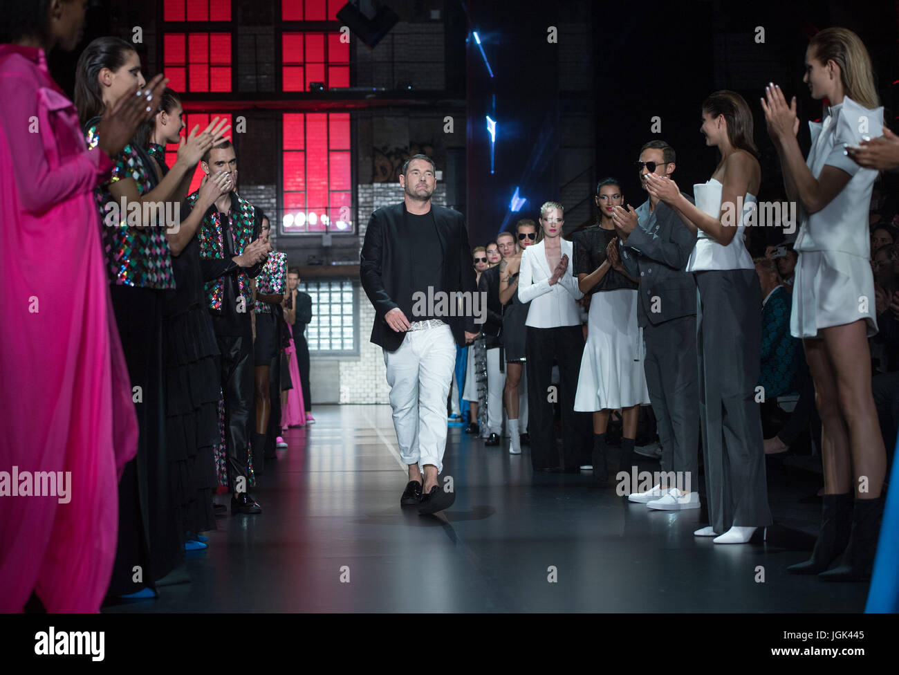Designer Michael Michalsky thanks the audience after the fashion ...