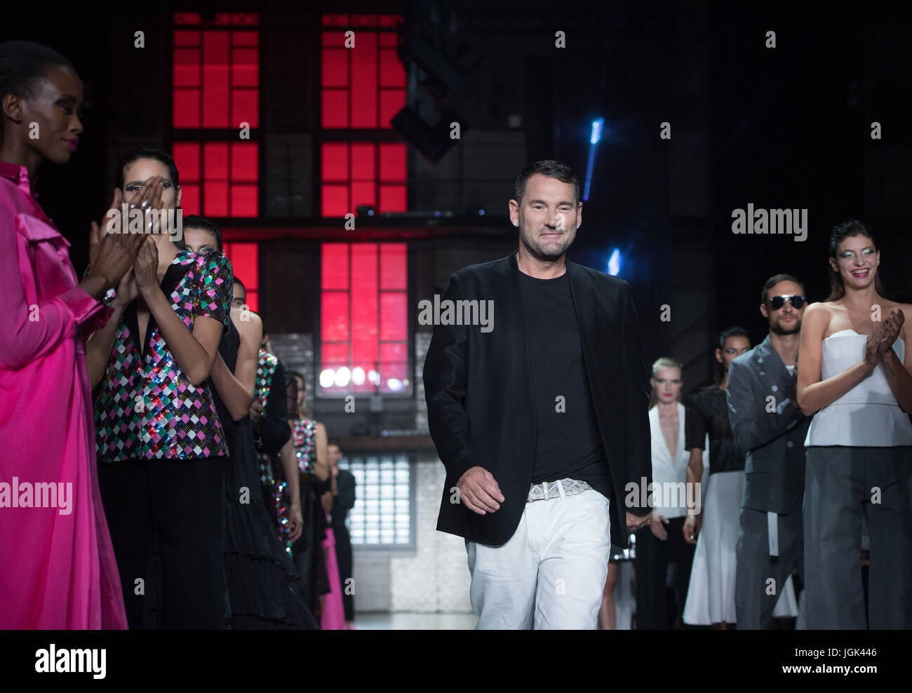 Designer Michael Michalsky thanks the audience after the fashion ...
