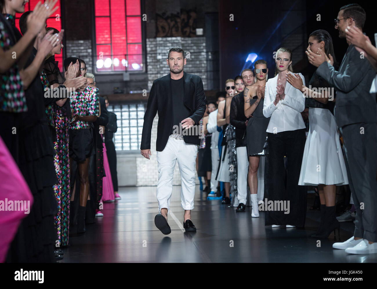 Designer Michael Michalsky thanks the audience after the fashion ...