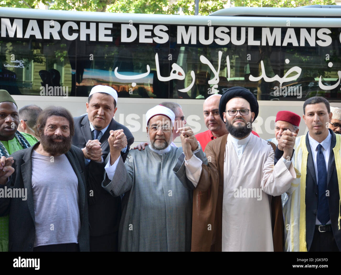 dpatop - Imams pray in front of a bus reading 'Mach of the muslims ...