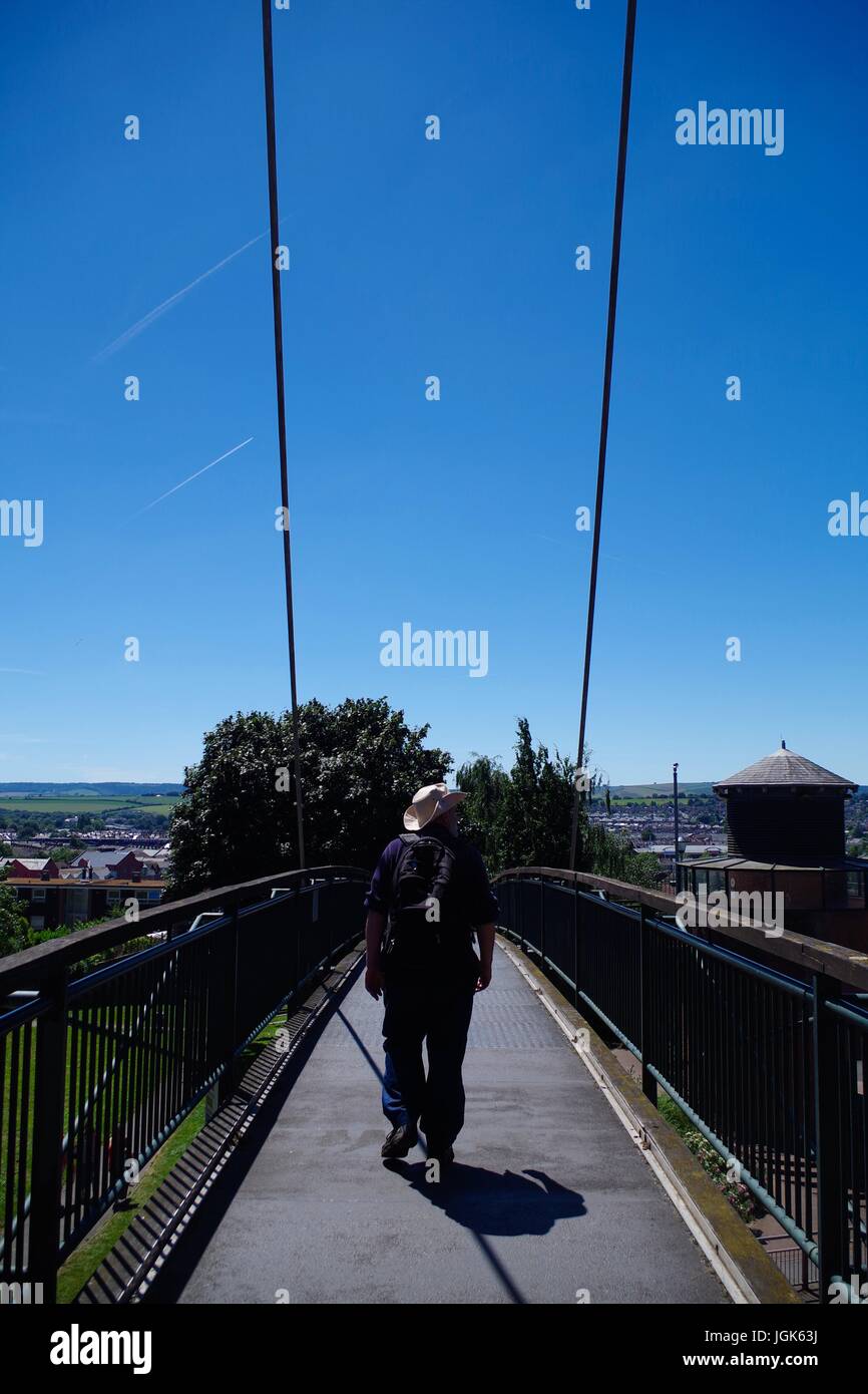 Man crossing metal pedestrian bridge hi-res stock photography and ...