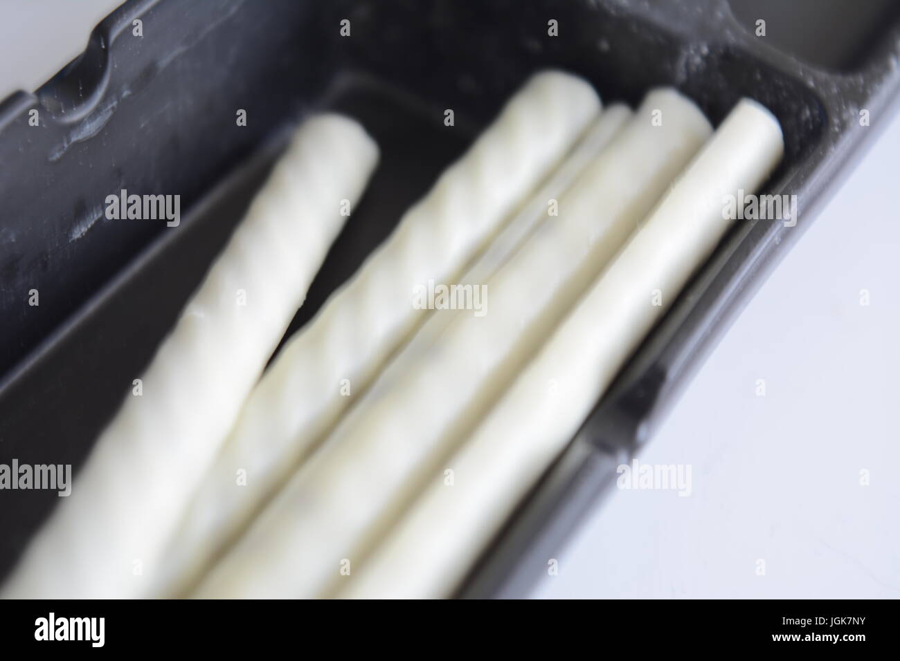 White chocolate sticks for coffee Stock Photo - Alamy
