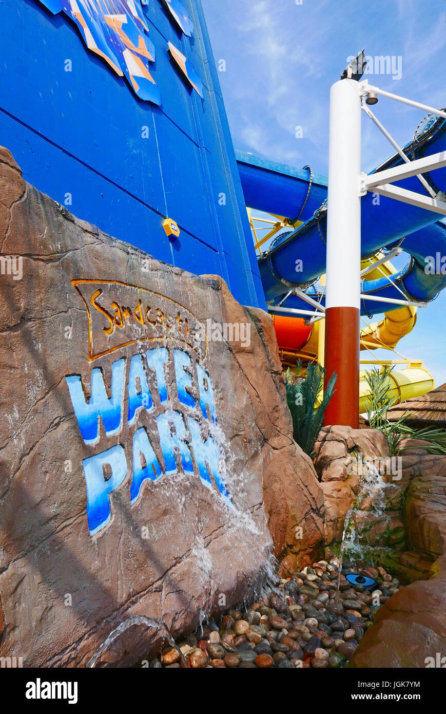 Sandcastle Water Park name carved in rock with water falling over it ...