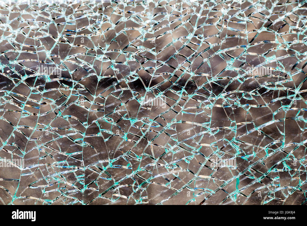 Shattered glass with cracks as a background Stock Photo - Alamy