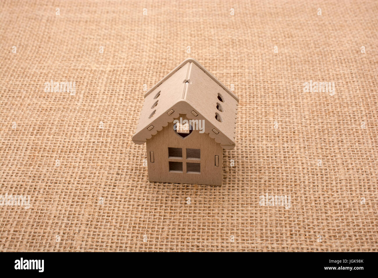 Little model house placed on a linen canvas Stock Photo - Alamy