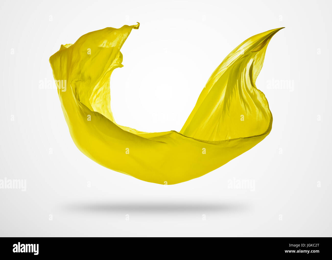 Smooth elegant yellow transparent cloth separated on gray background ...