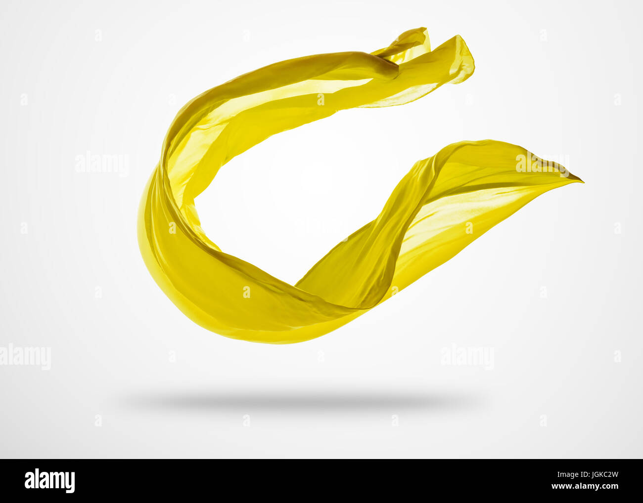 Smooth elegant yellow transparent cloth separated on gray background ...
