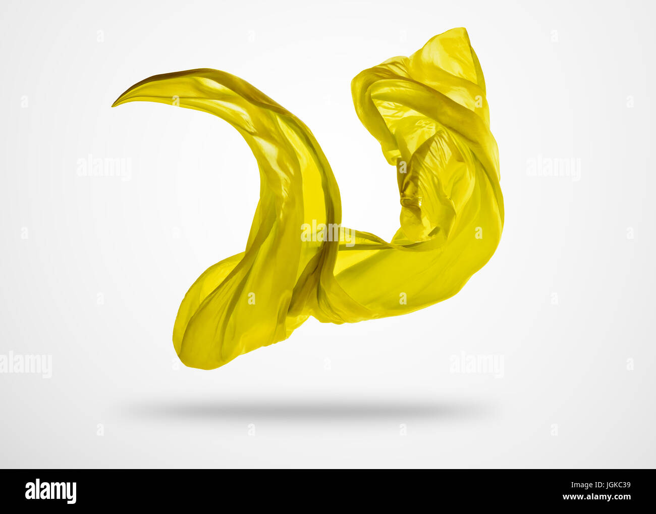 Smooth elegant yellow transparent cloth separated on gray background ...