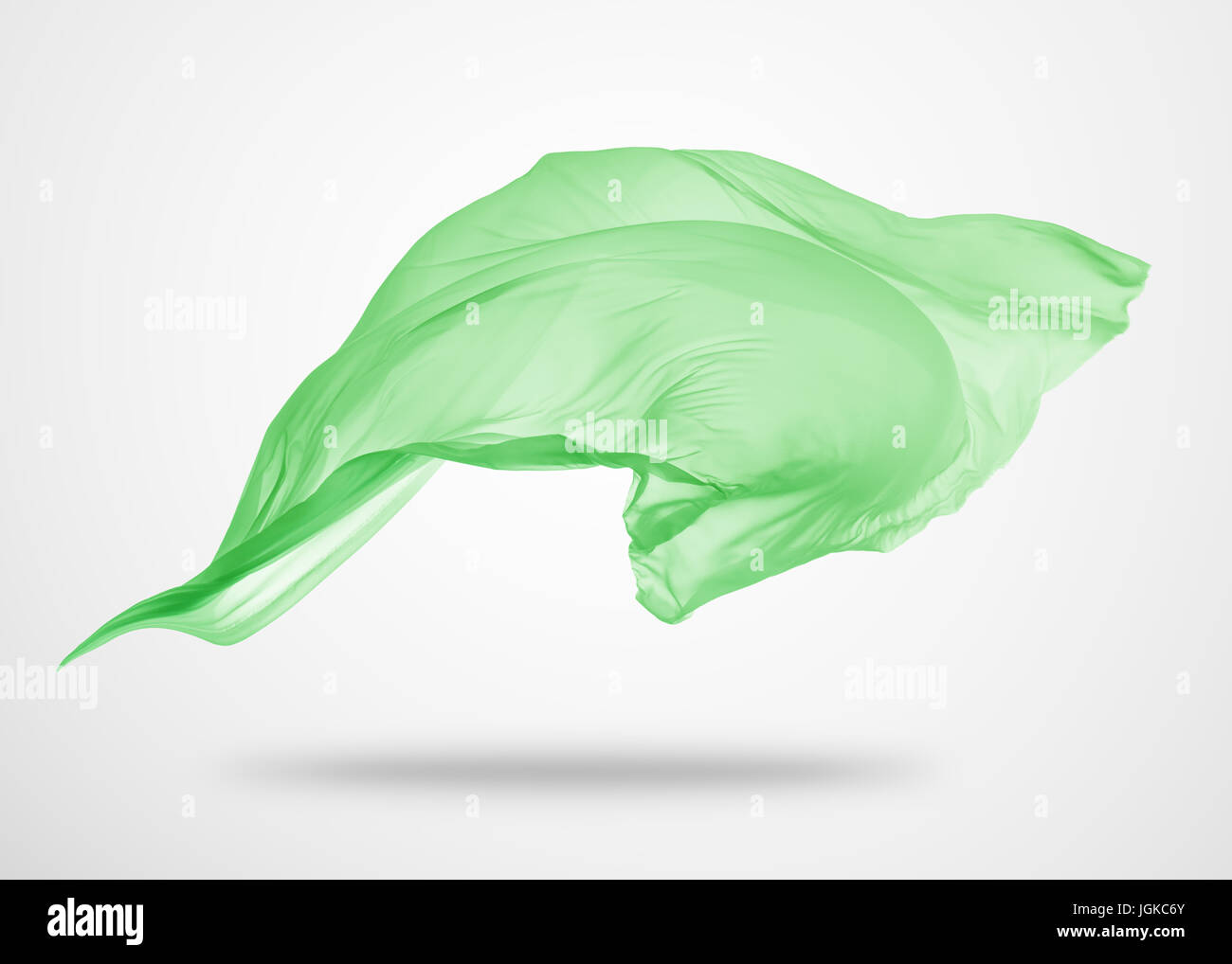 Smooth elegant transparent green cloth separated on gray background ...