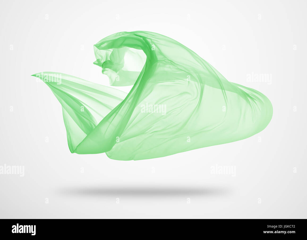 Smooth elegant transparent green cloth separated on gray background ...