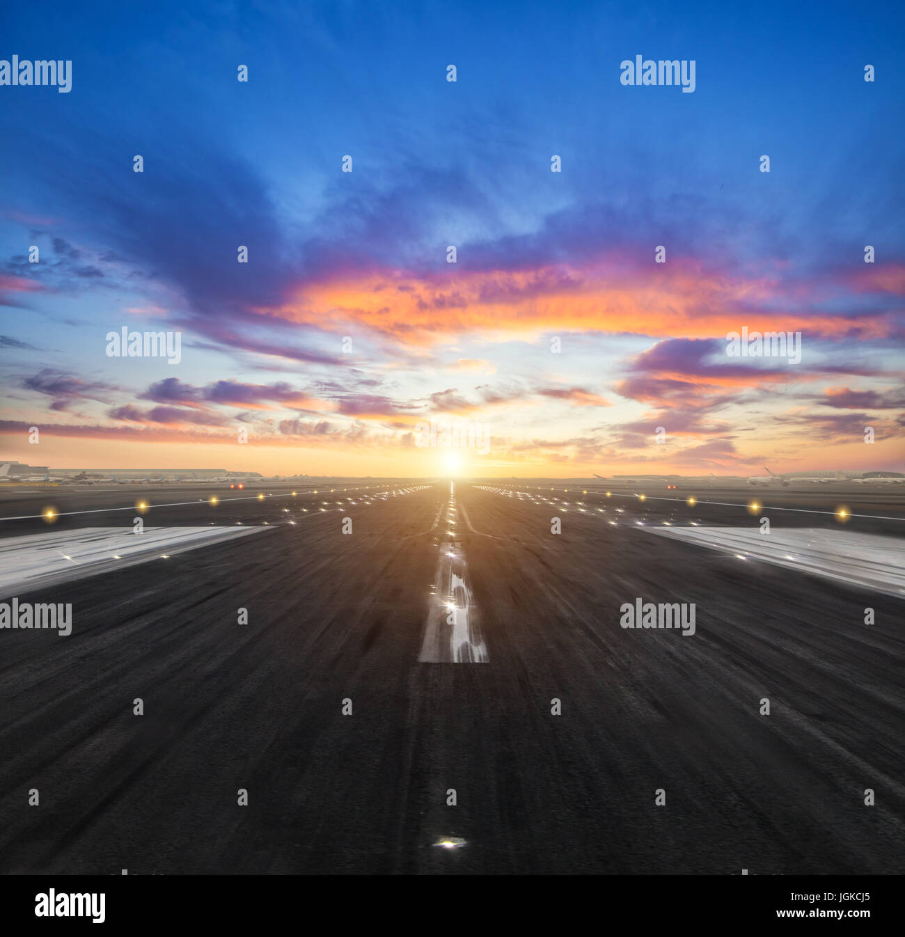 airport runway in the evening sunset light, ready for airplane landing ...